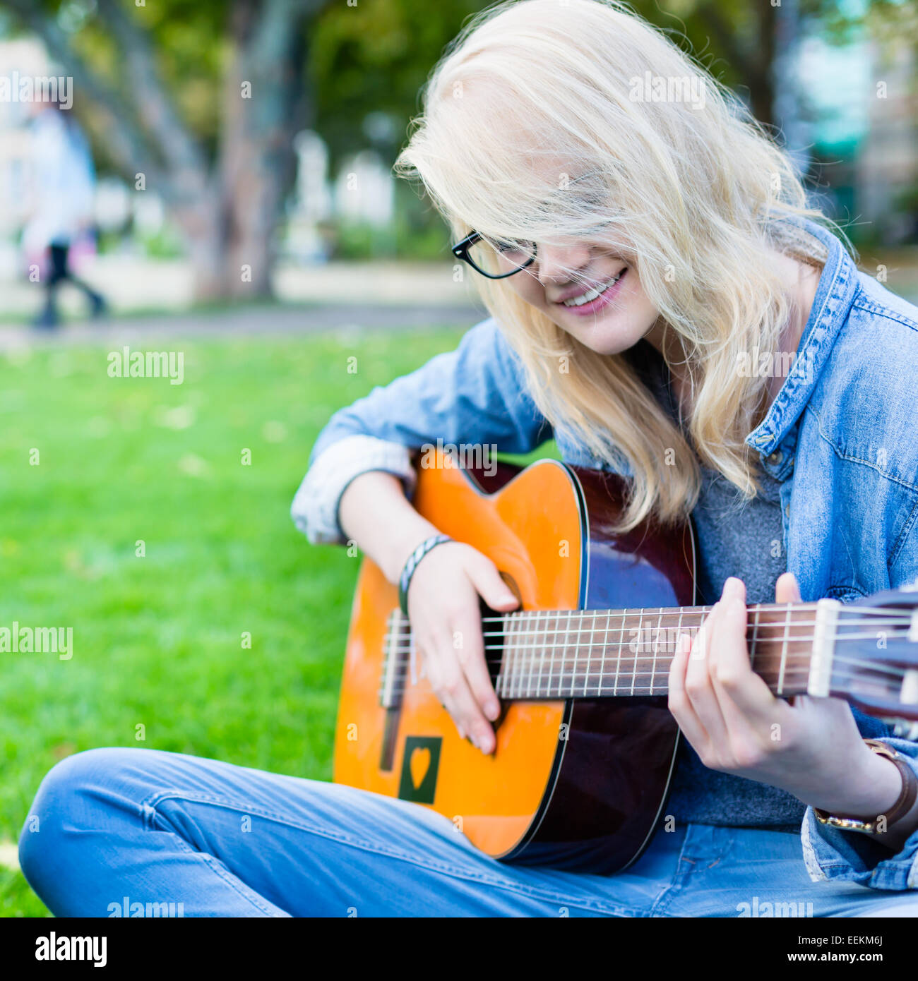 Friends singing songs in park having fun together Stock Photo - Alamy