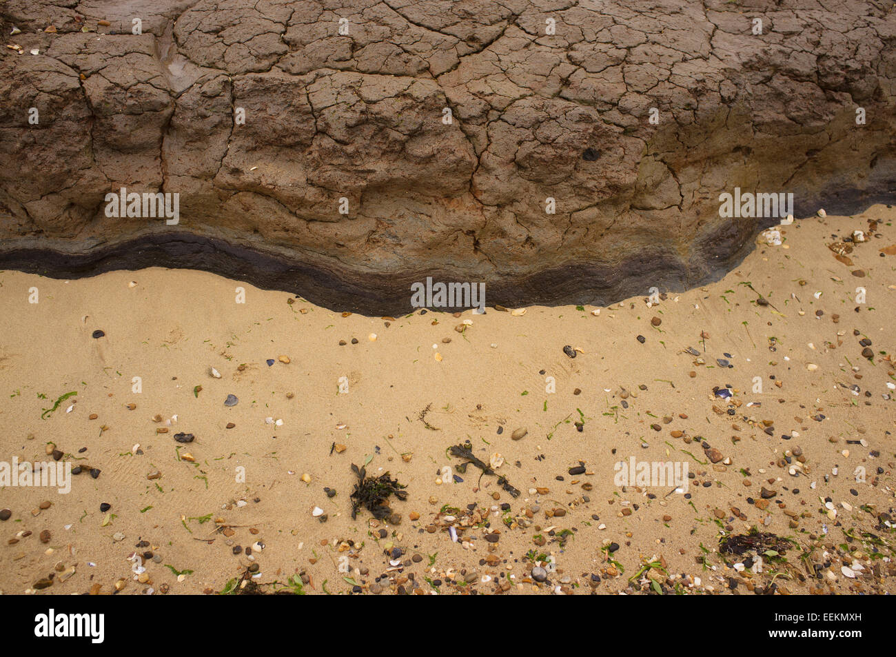 Clay and sand on beach Stock Photo - Alamy