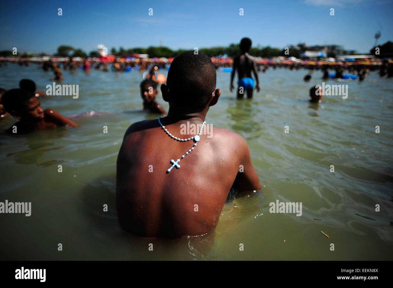 Beach goers enjoy the waters of Palm Piscinão, north of the city of Rio ...