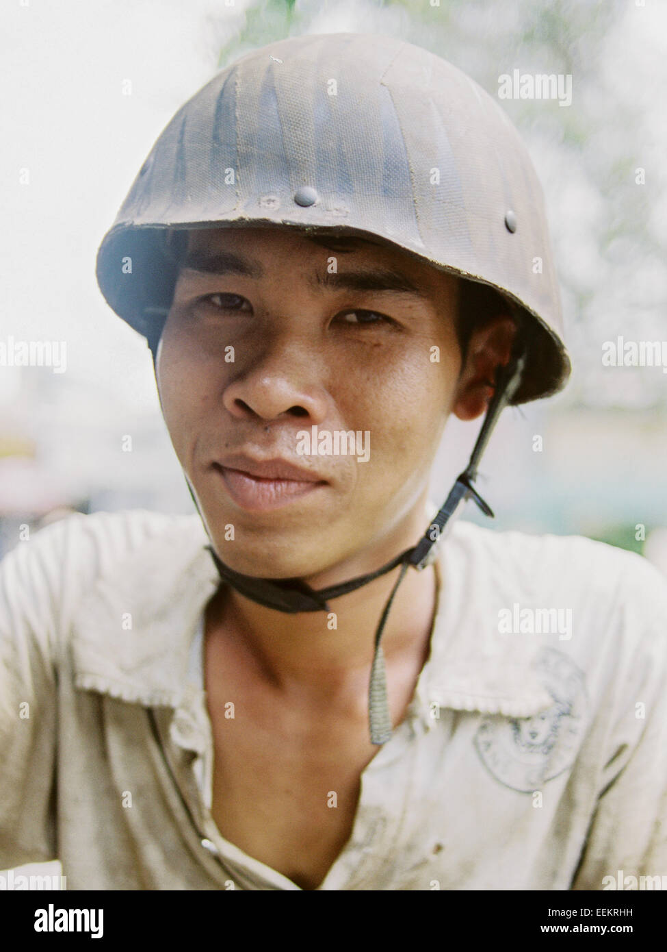 Young vietnamese man wearing army helmet Stock Photo - Alamy