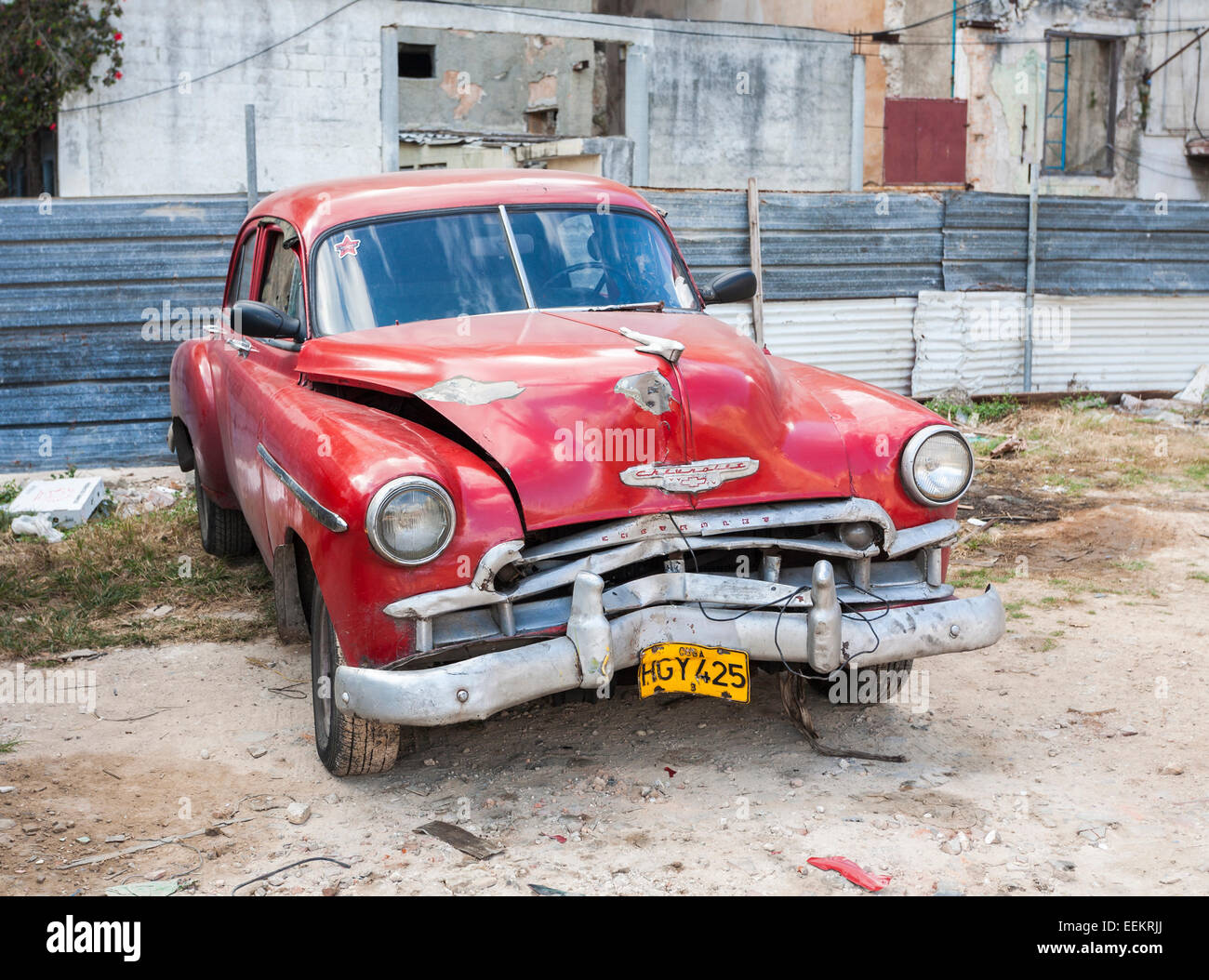 Vintage, collision damaged post-accident classic red Chevrolet parked ...