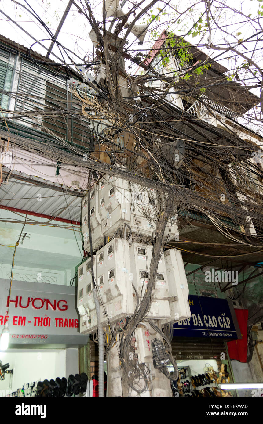 Mess of electric cables and telephone wires hi-res stock photography ...
