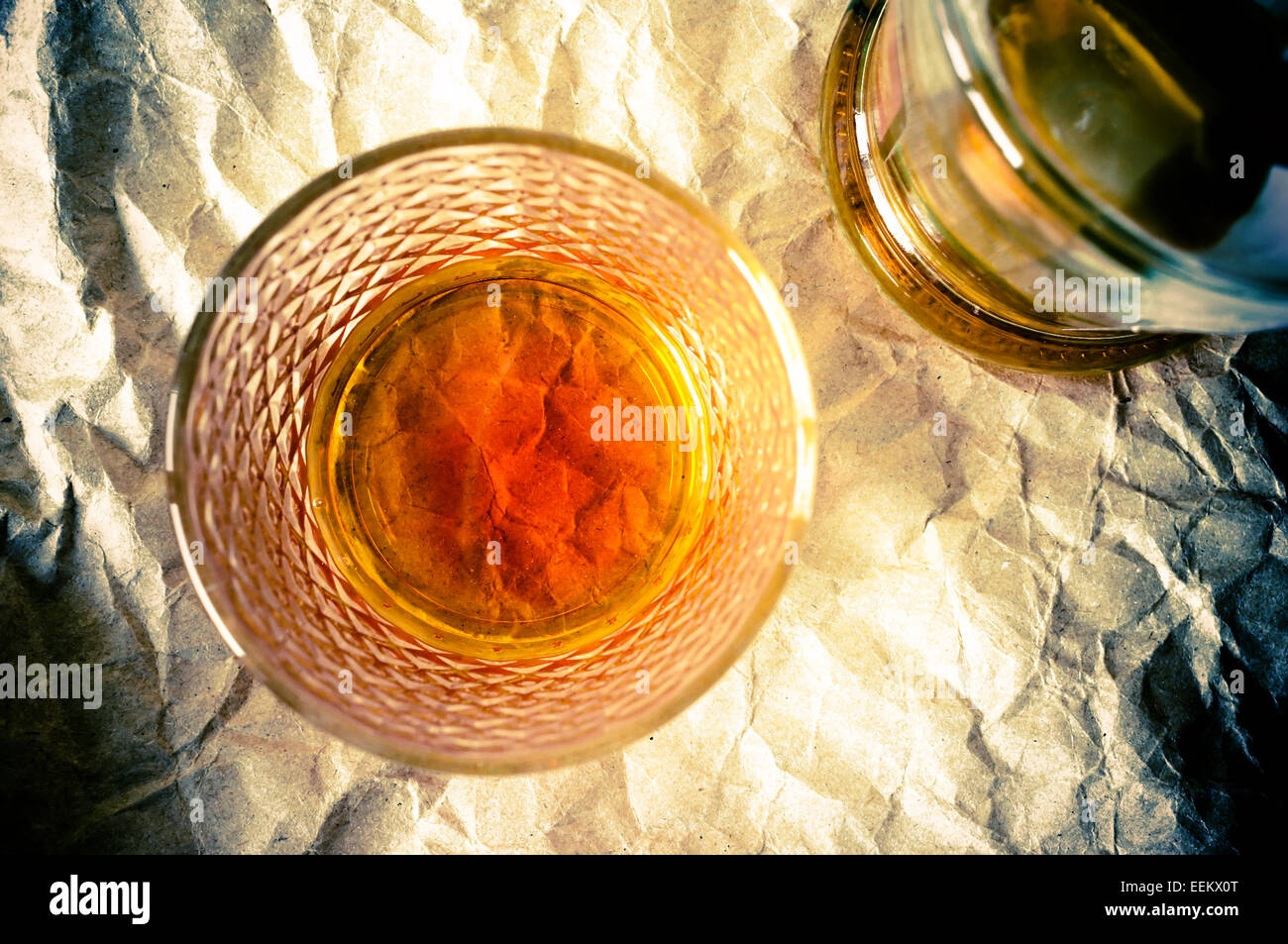 Shot with cognac, brandy on the table in dim lighting Stock Photo - Alamy