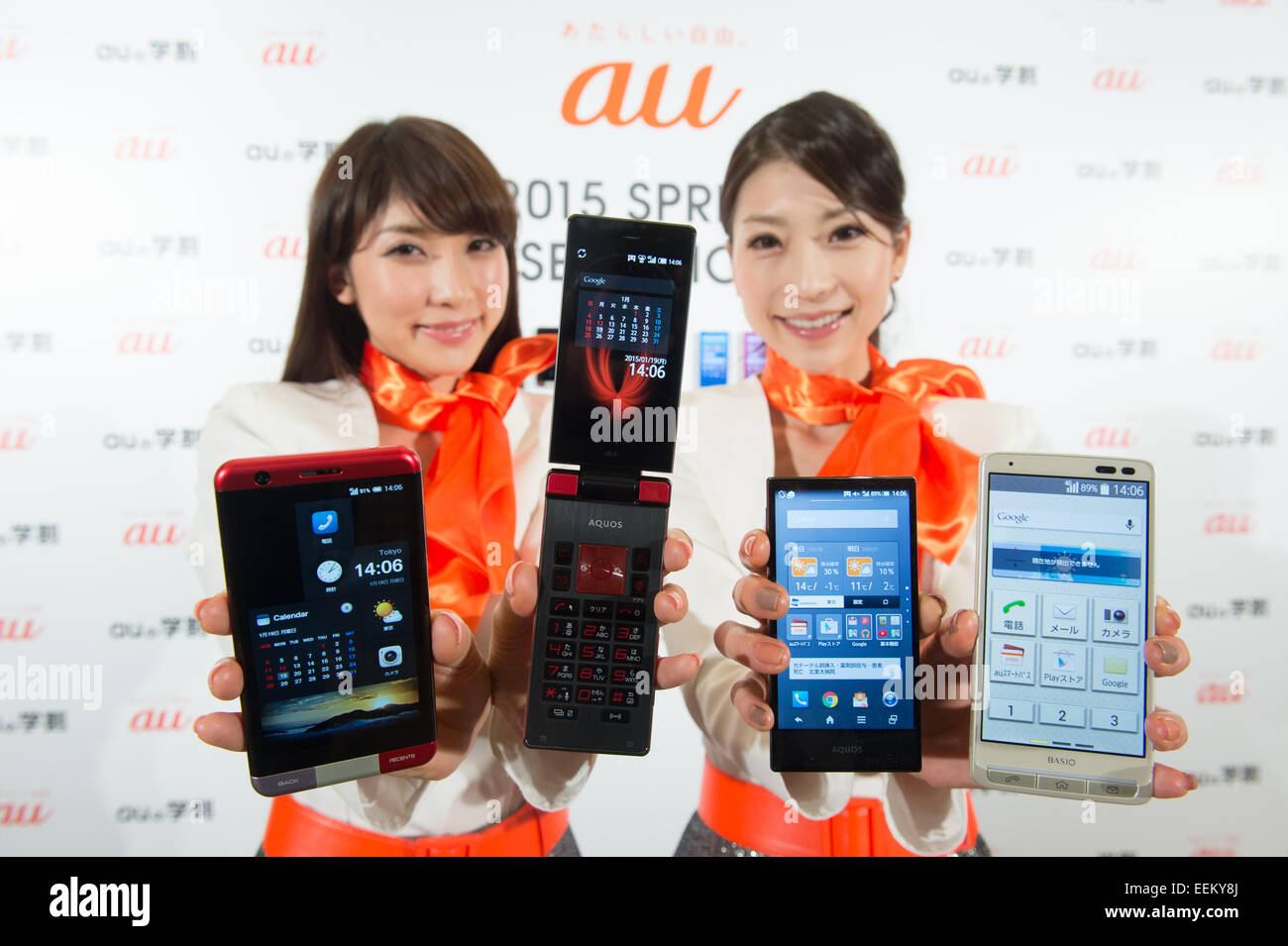 Tokyo, Japan. 19th Jan, 2015. Models show a new lineup of KDDI's smartphones during a news ...