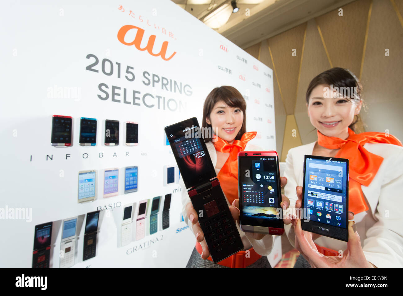 Tokyo, Japan. 19th Jan, 2015. Models show a new lineup of KDDI's ...