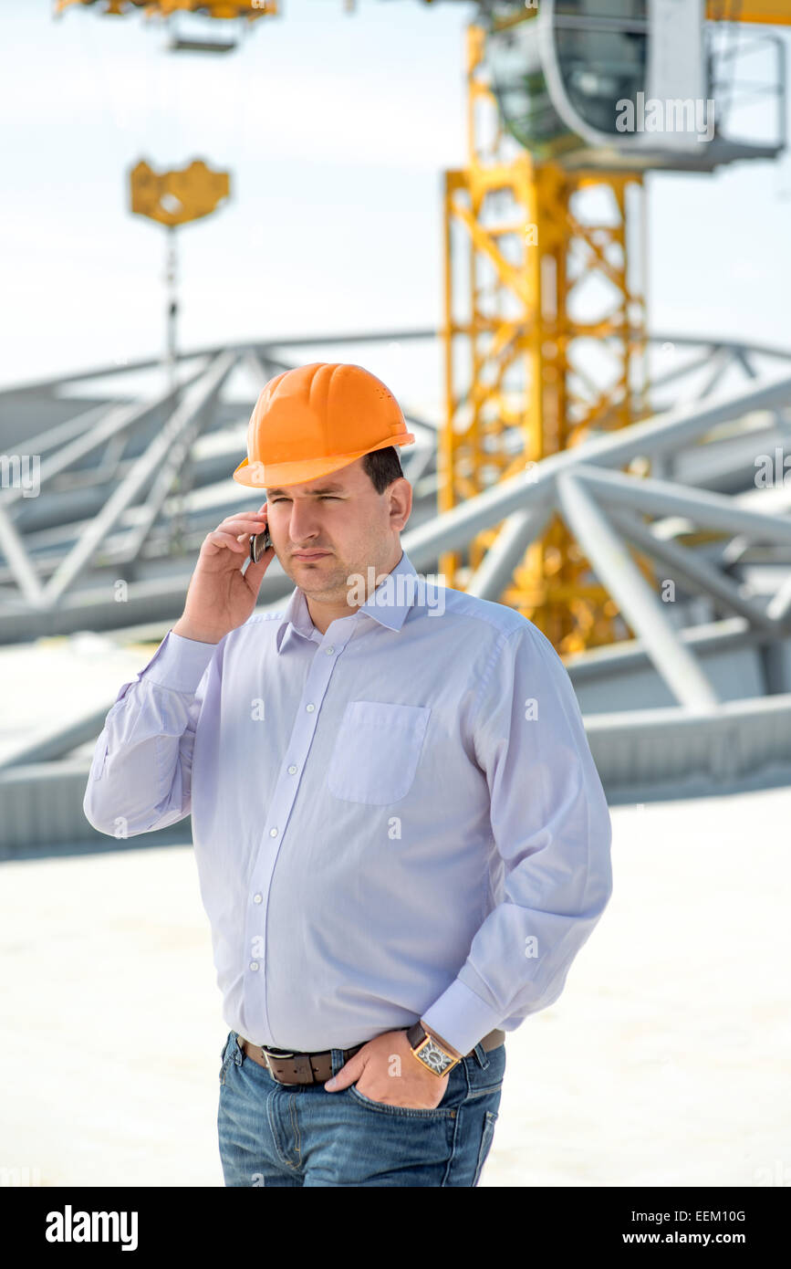 A foreman at the construction supervising the project Stock Photo - Alamy