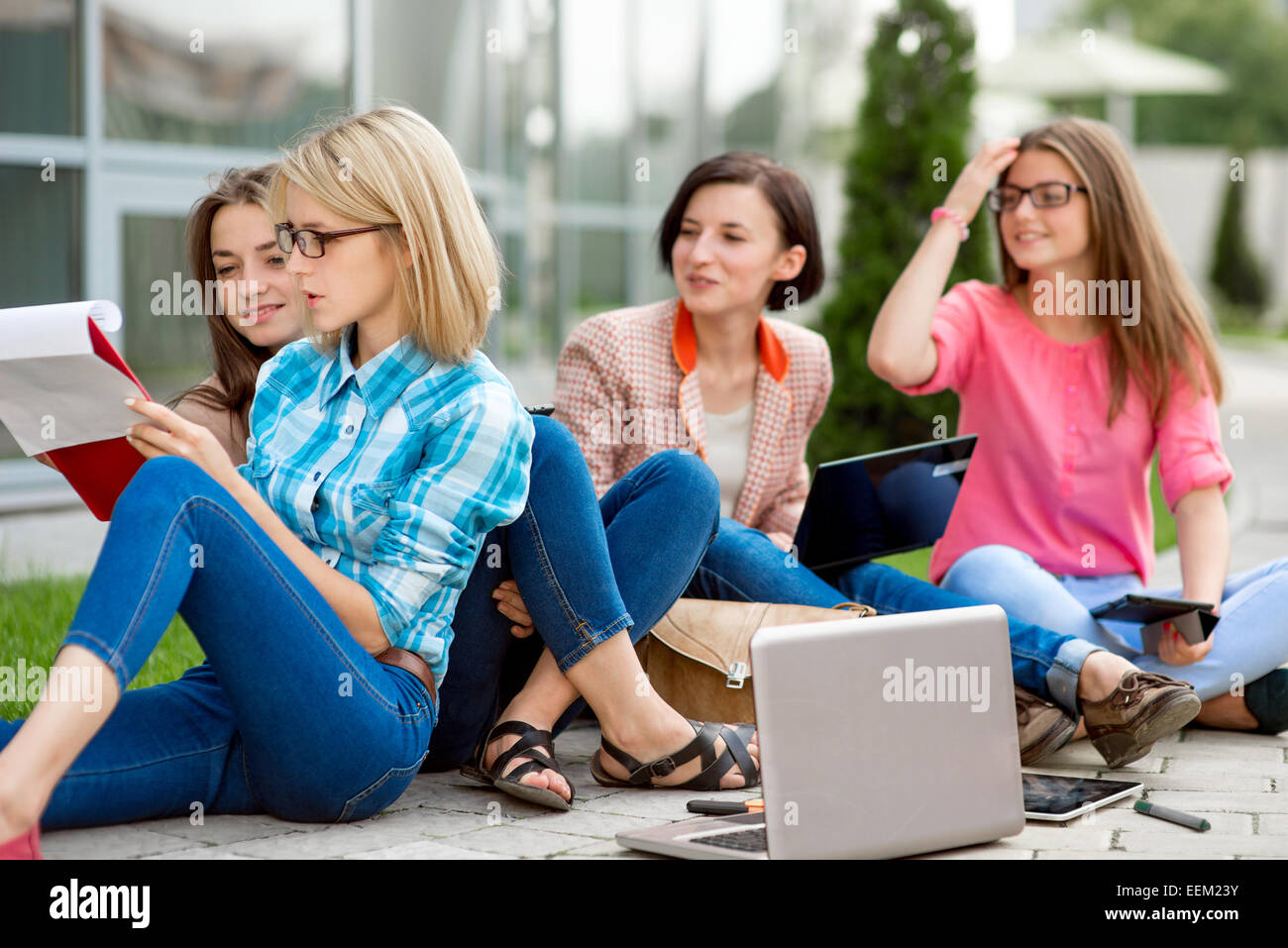 Young and happy girlfriends or classmates having fun at the School or ...