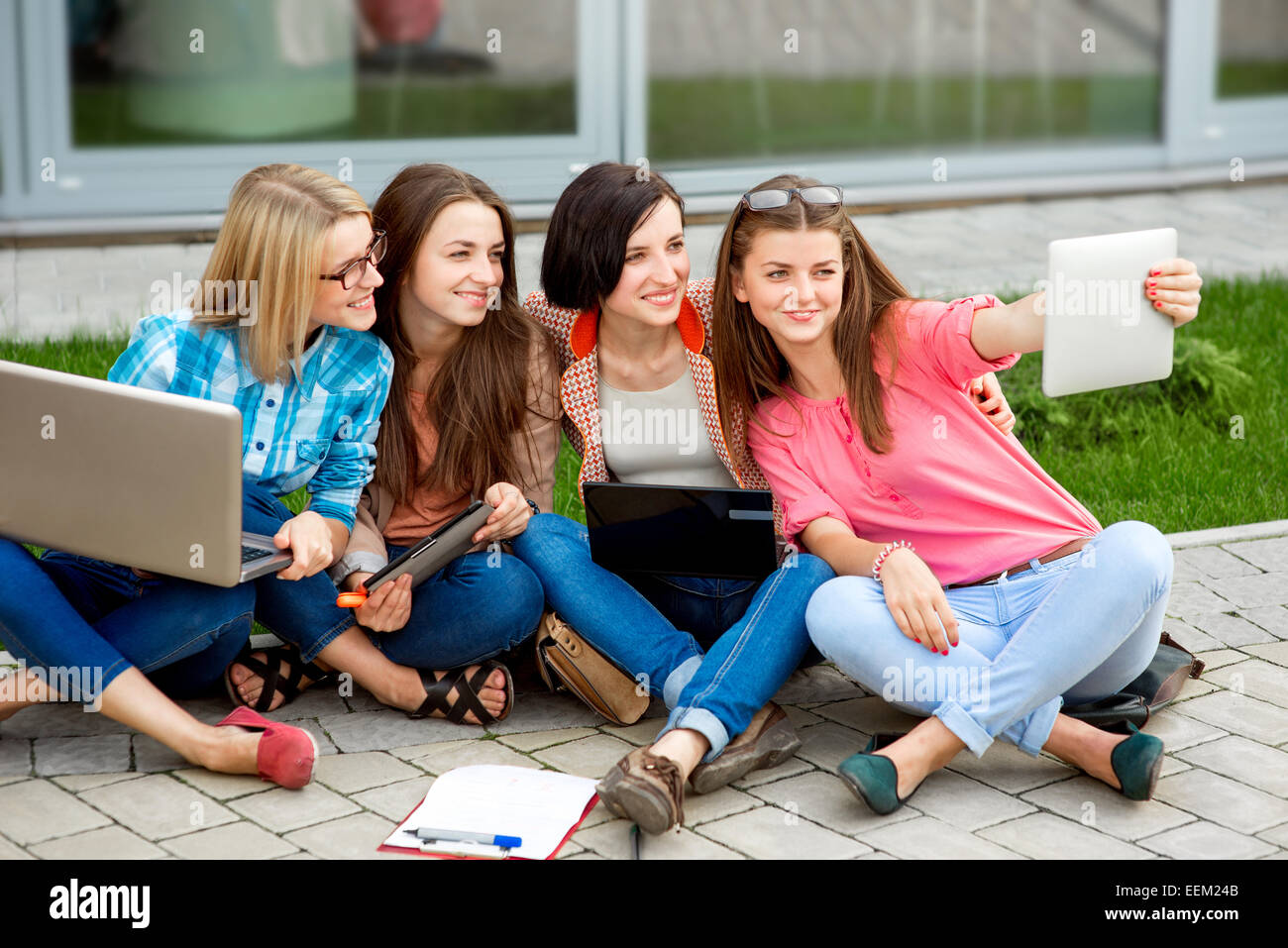 Young and happy girlfriends or classmates having fun at the School or ...