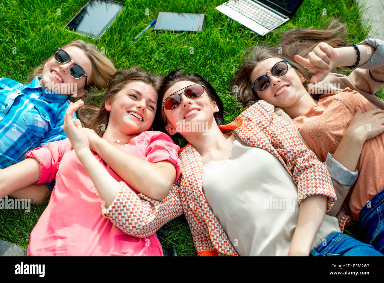 Young and happy girlfriends or classmates having fun at the School or ...