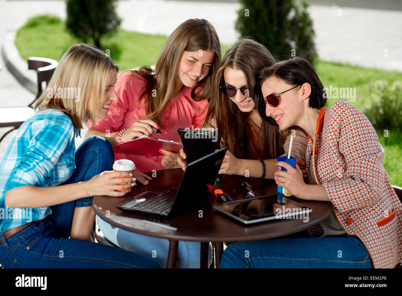 Young and happy girlfriends or classmates having fun at the School or ...