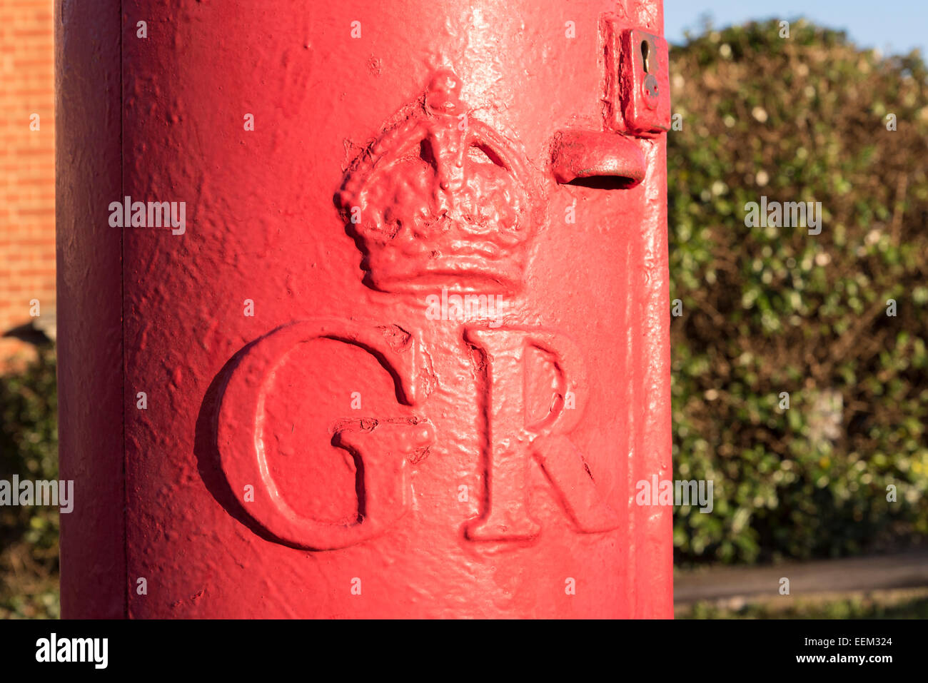 Close up of a George V monogram on a red post box outside Cheshunt ...