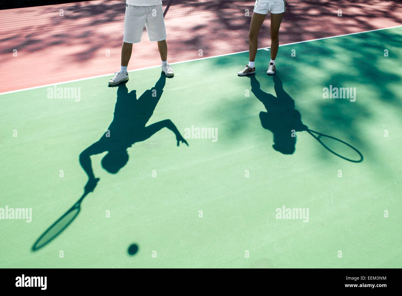 Players shadows or silhouettes on the tennis court playing tennis Stock ...