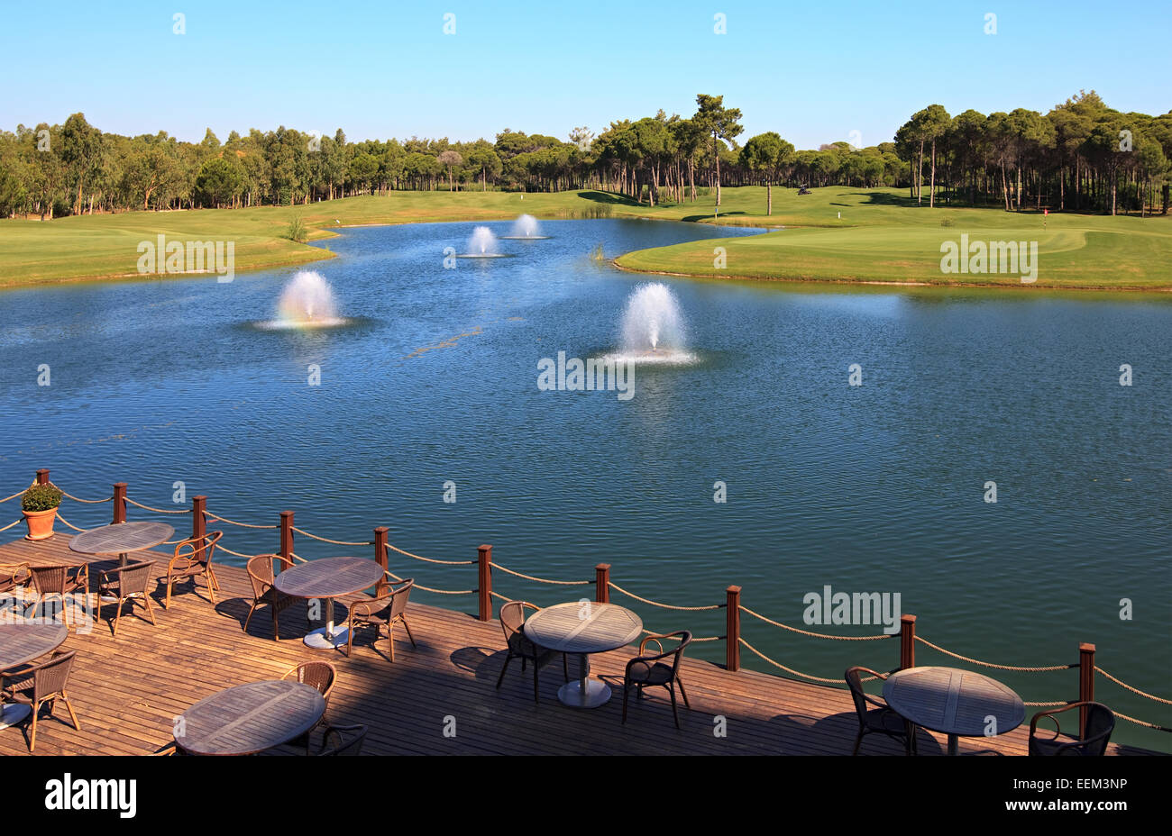 Cafe on the artificial pond with fountain Stock Photo - Alamy