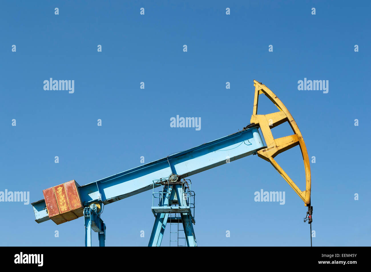 Upper elements of a blue pumpjack on blue sky background Stock Photo ...
