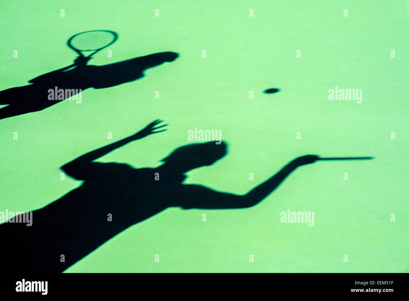 Players shadows or silhouettes on the tennis court playing tennis Stock ...