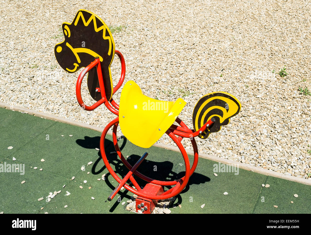 Wooden rocking horse for kids in a park Stock Photo - Alamy