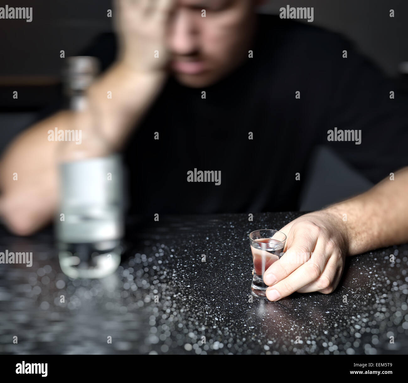 Enervate man addicted to alcohol Stock Photo - Alamy