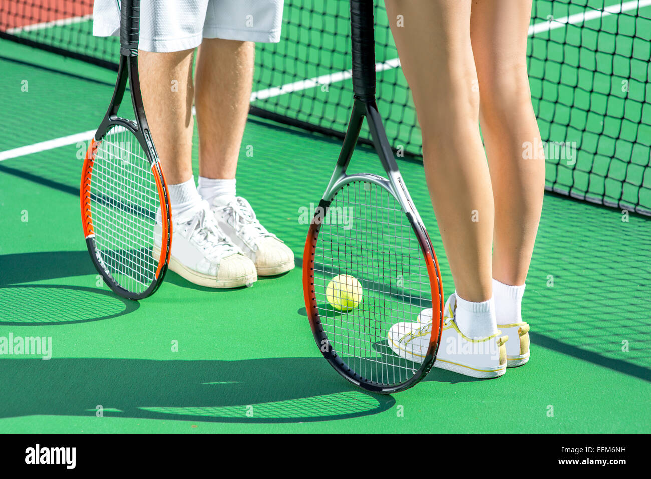 Players holding tennis rackets at th tennis court Stock Photo - Alamy