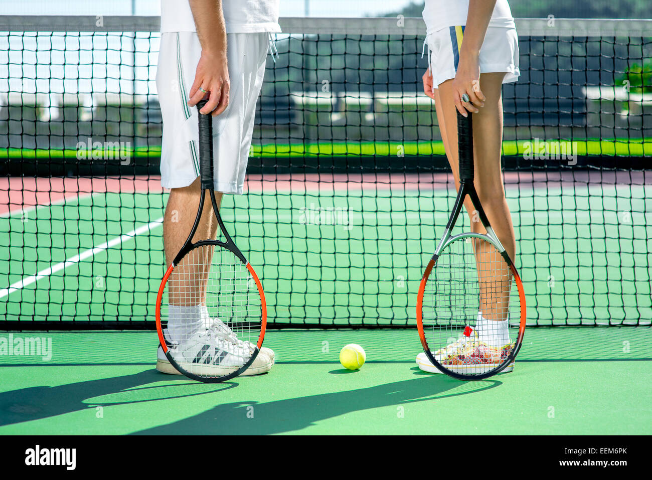 Players holding tennis rackets at th tennis court Stock Photo - Alamy