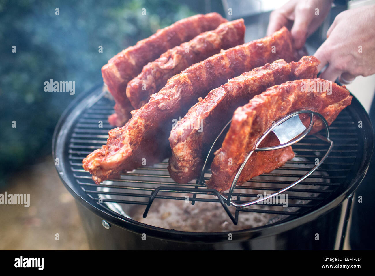 Men grilling meat hi-res stock photography and images - Alamy