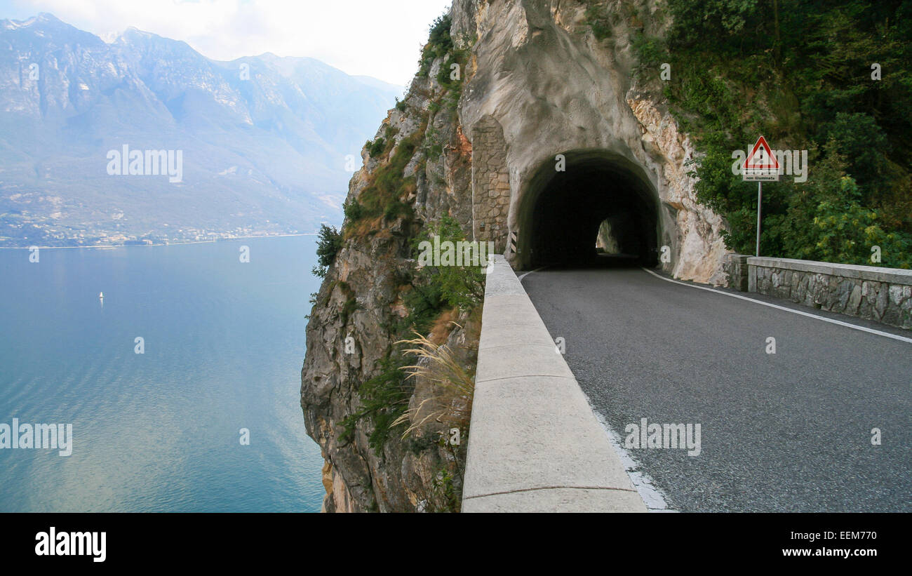 Italy, Lake Garda, Road leading into mountain tunnel Stock Photo - Alamy