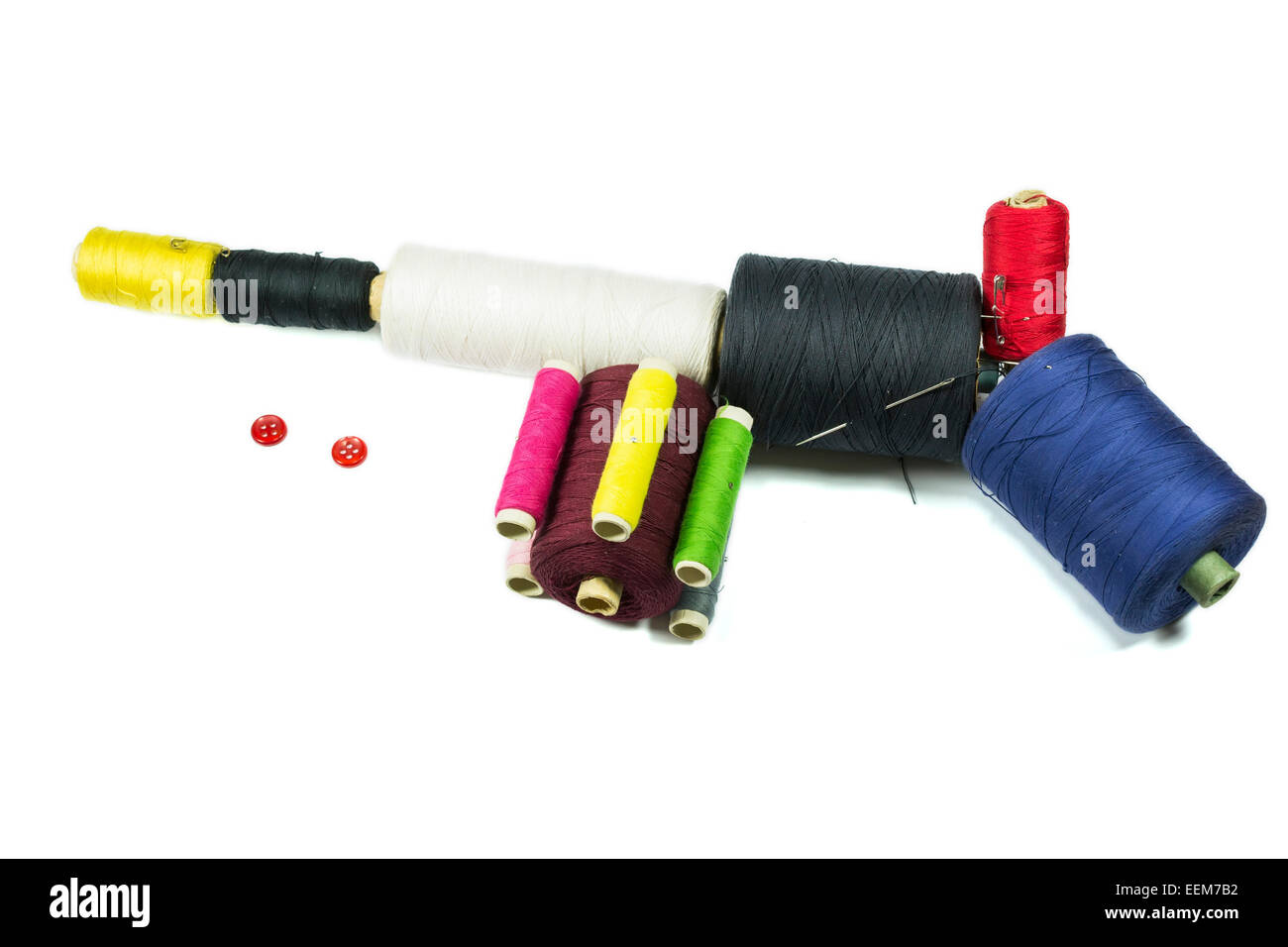 Machine gun improvised from colored sewing thread reels giving the ...