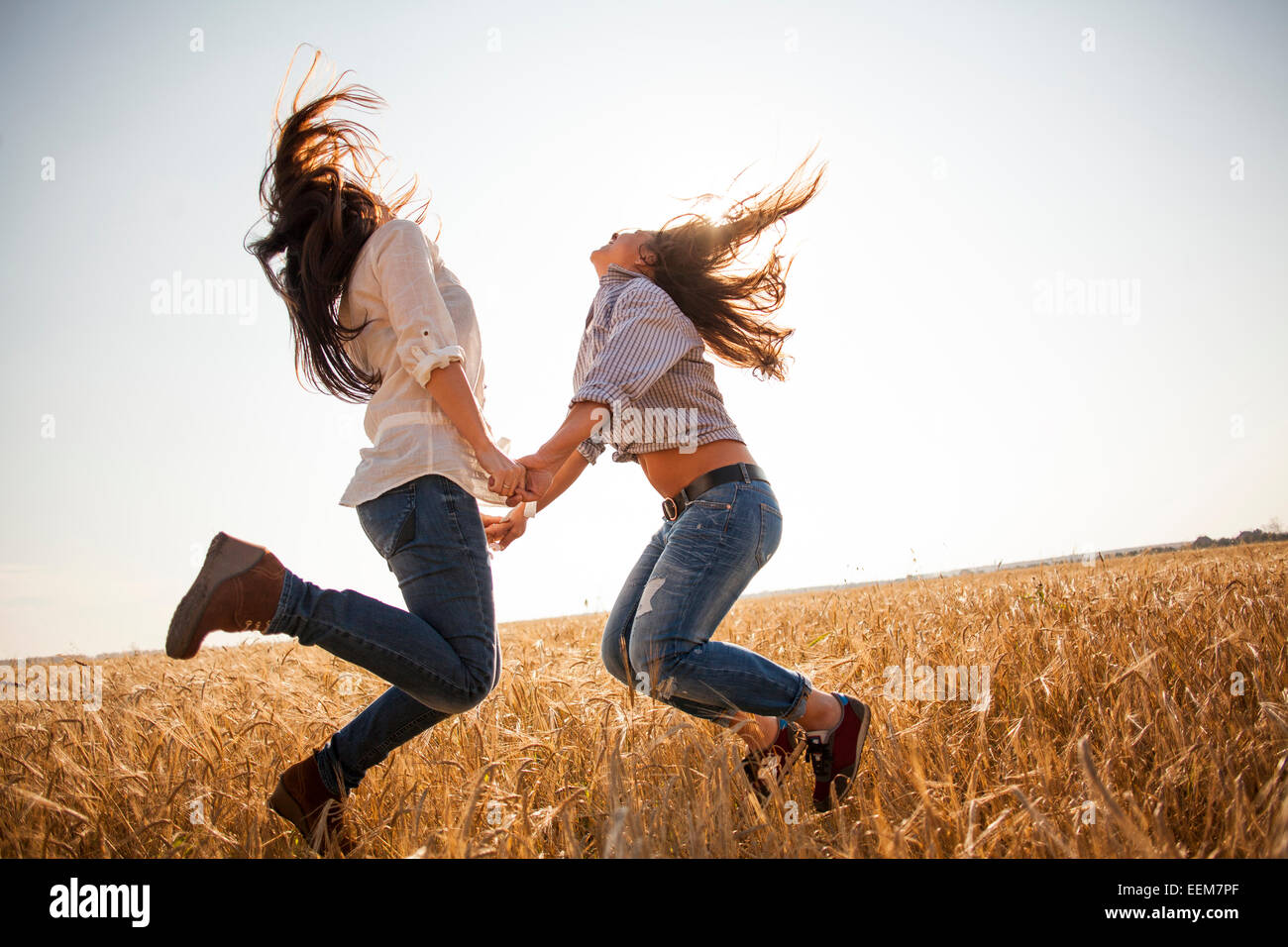 Three dancing women in landscape hi-res stock photography and images ...