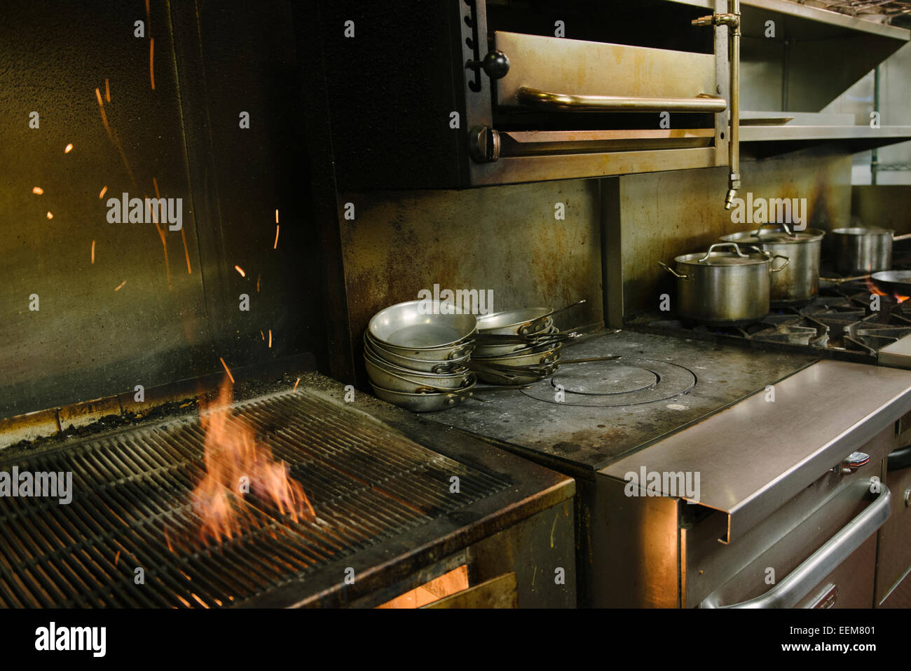 Flaming grill in restaurant kitchen Stock Photo - Alamy