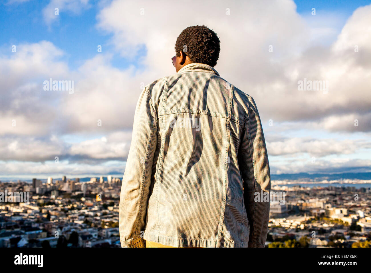 Black man looking at scenic view of cityscape Stock Photo - Alamy