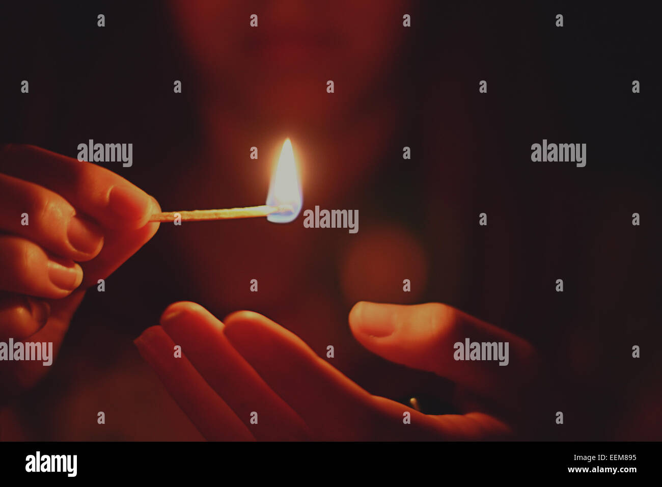 Person holding burning match hi-res stock photography and images - Alamy