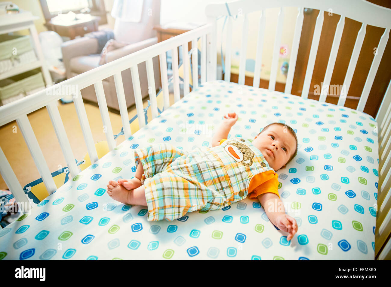 Caucasian baby boy laying in crib Stock Photo - Alamy