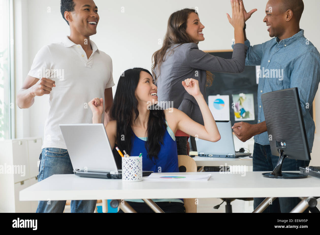 Business people cheering in office Stock Photo - Alamy