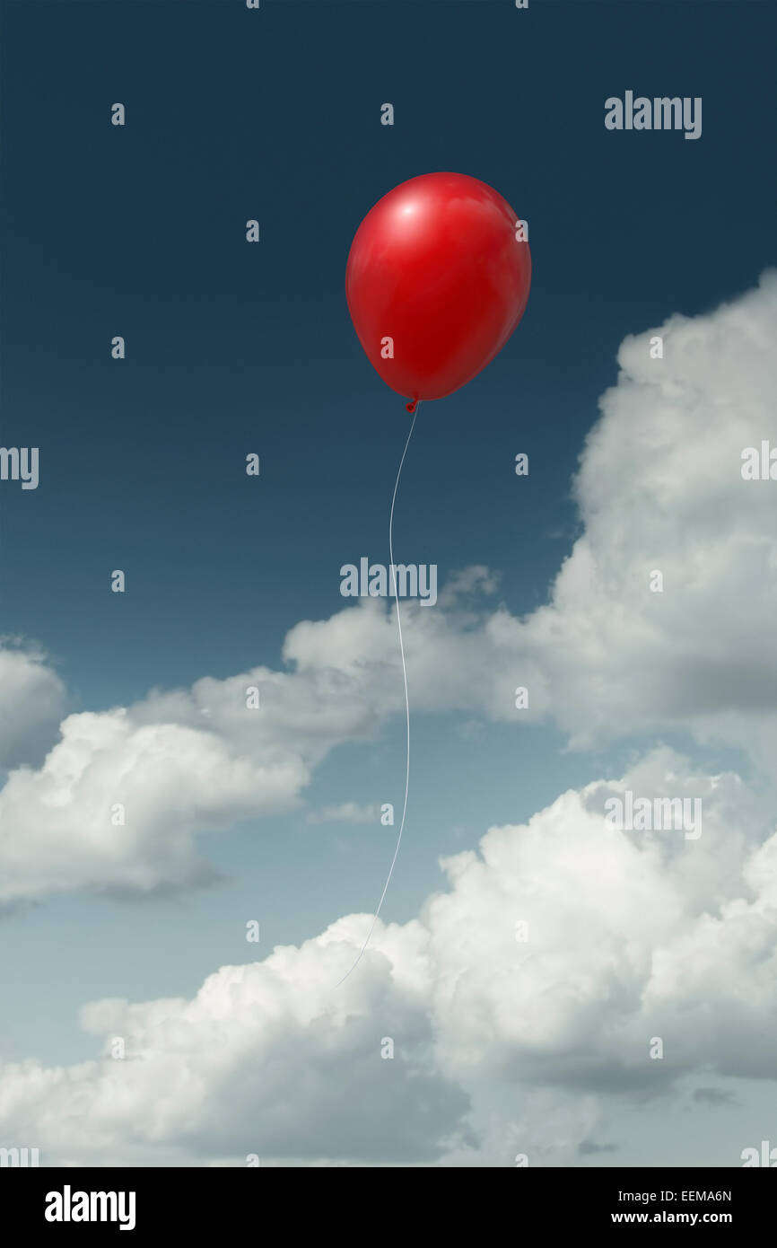 Red balloon floating in cloudy sky Stock Photo - Alamy