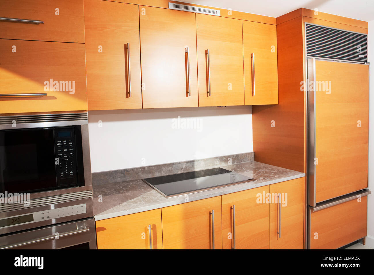 Cabinets, stove and countertop in modern kitchen Stock Photo - Alamy