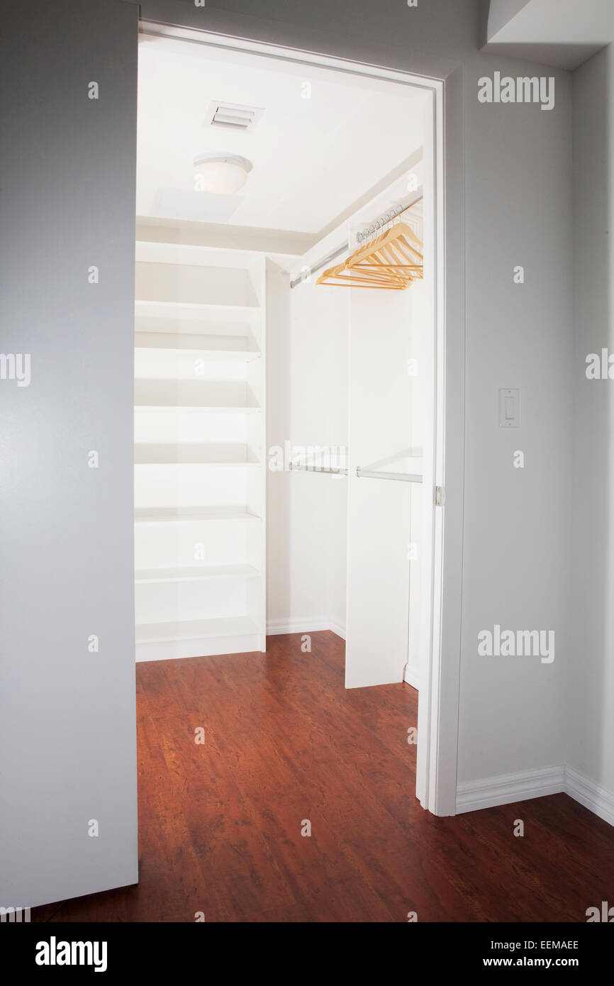 Door to empty walk-in closet Stock Photo - Alamy