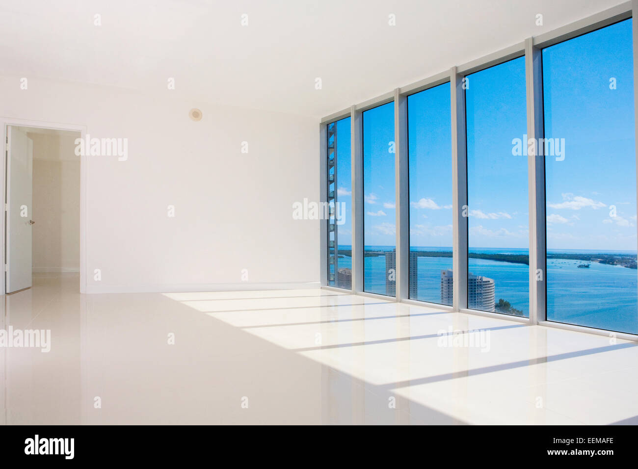 Windows in empty modern living space Stock Photo - Alamy