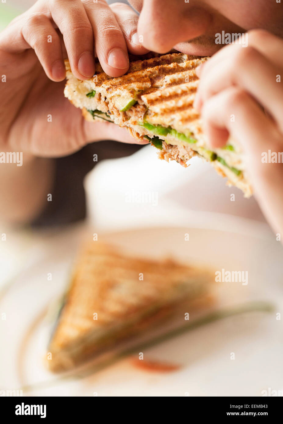 Man eating tuna sandwich hi-res stock photography and images - Alamy