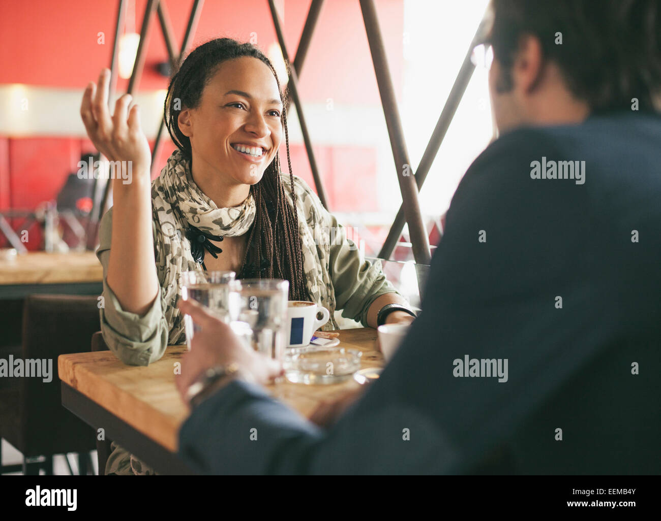 Couple talking in cafe Stock Photo - Alamy