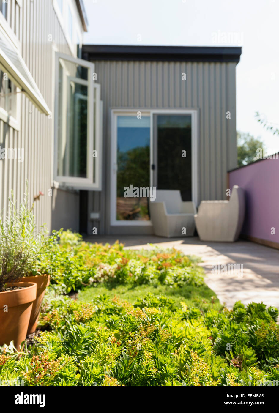 Landscaping and patio of modern condo building Stock Photo - Alamy