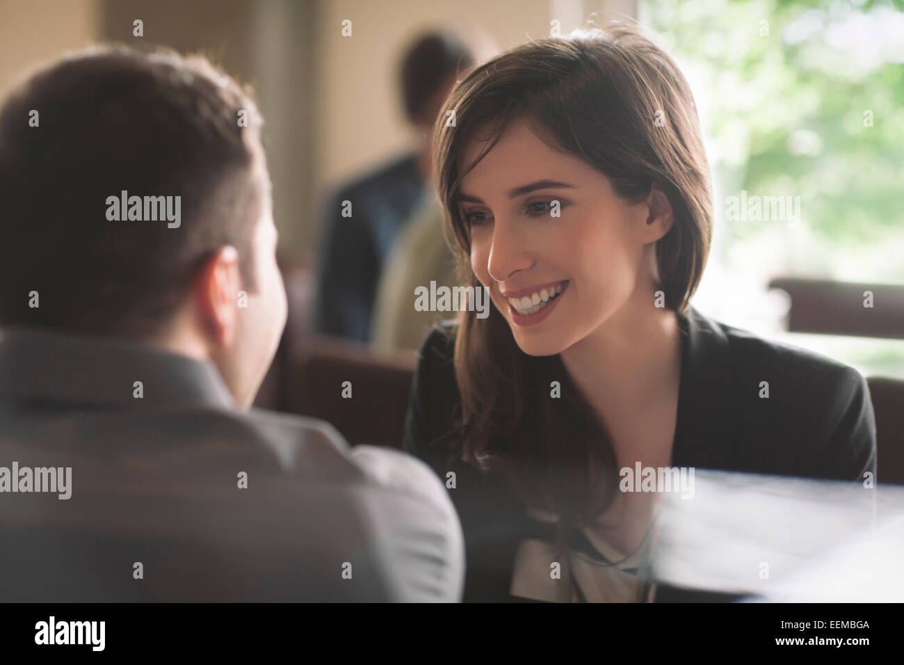 Couple talking in cafe Stock Photo - Alamy