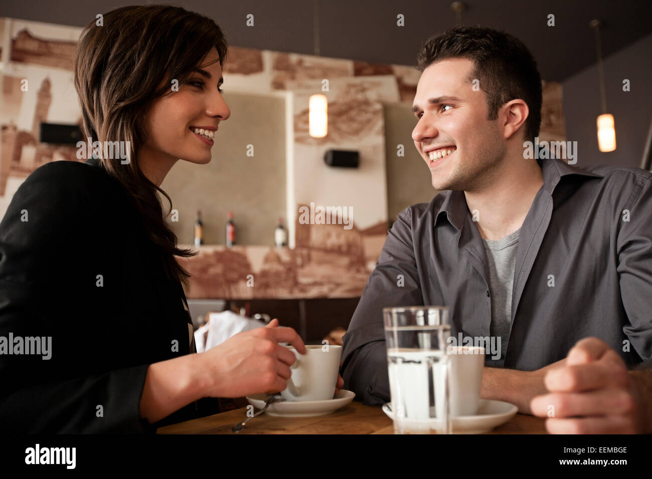Couple drinking coffee in cafe Stock Photo - Alamy