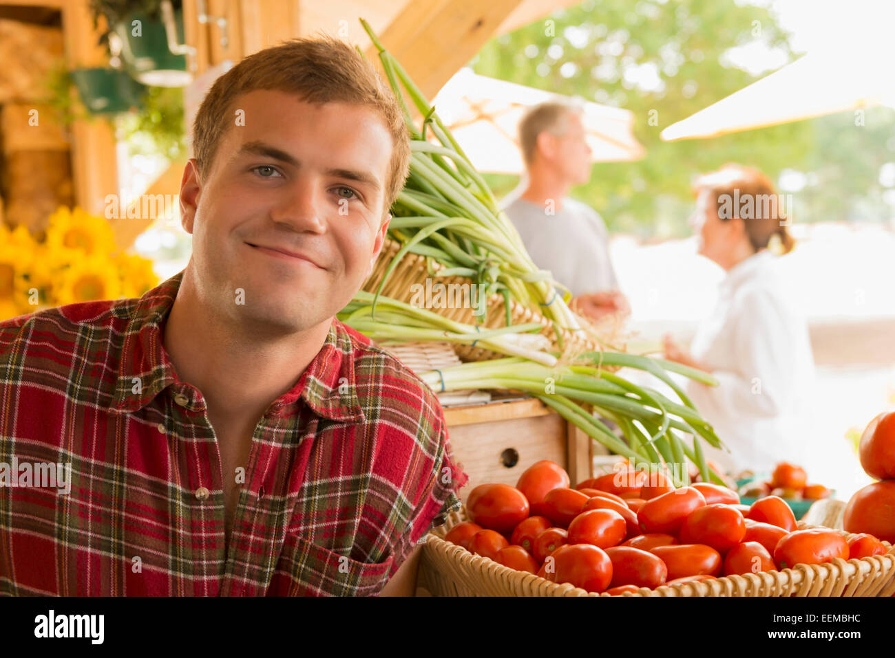 Caucasian man with produce at farmers market Stock Photo - Alamy