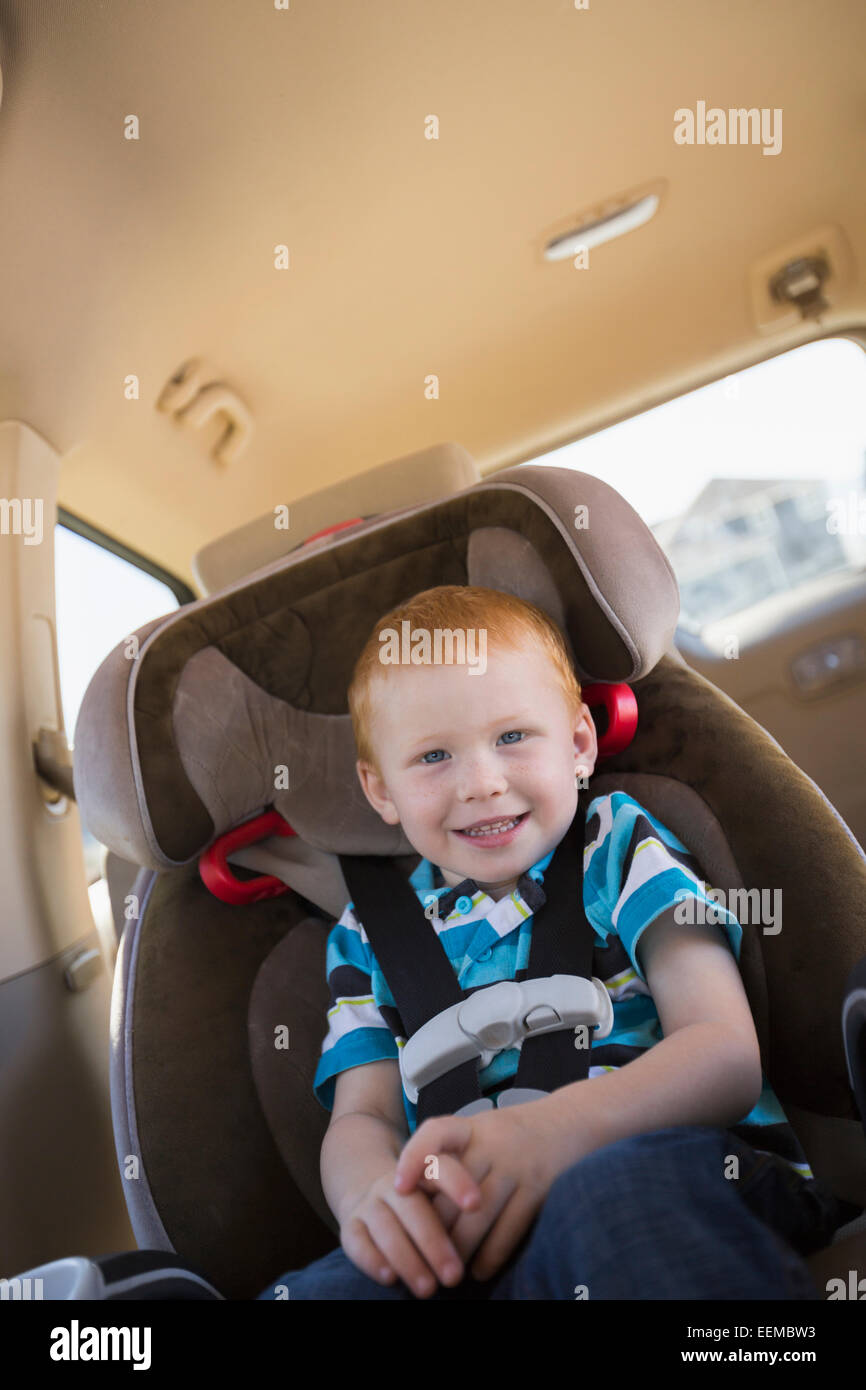 Happy boy sitting in a car seat hi-res stock photography and images - Alamy