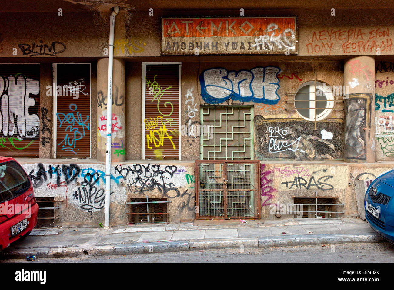 Graffiti covering urban wall in city Stock Photo - Alamy