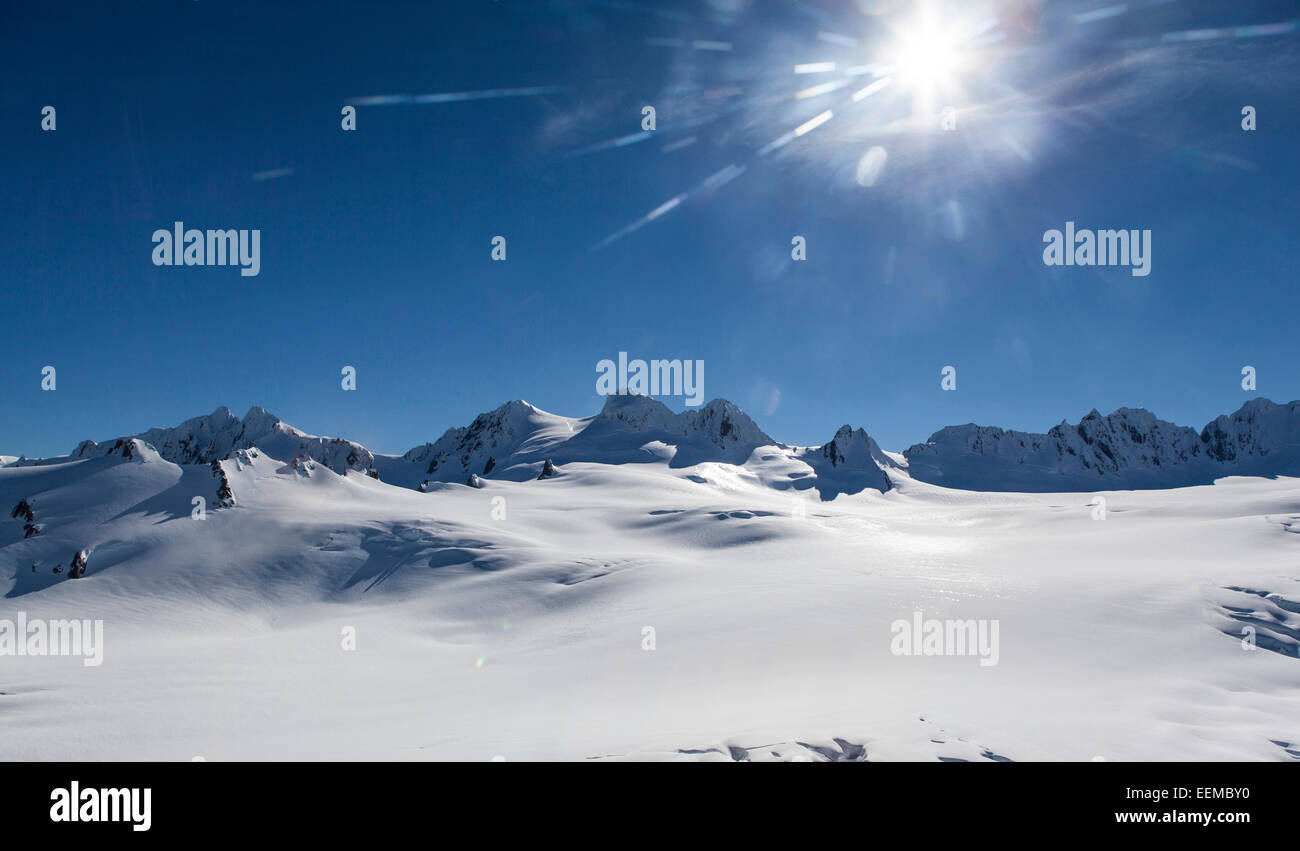 Snow covered mountain tops in remote landscape Stock Photo - Alamy