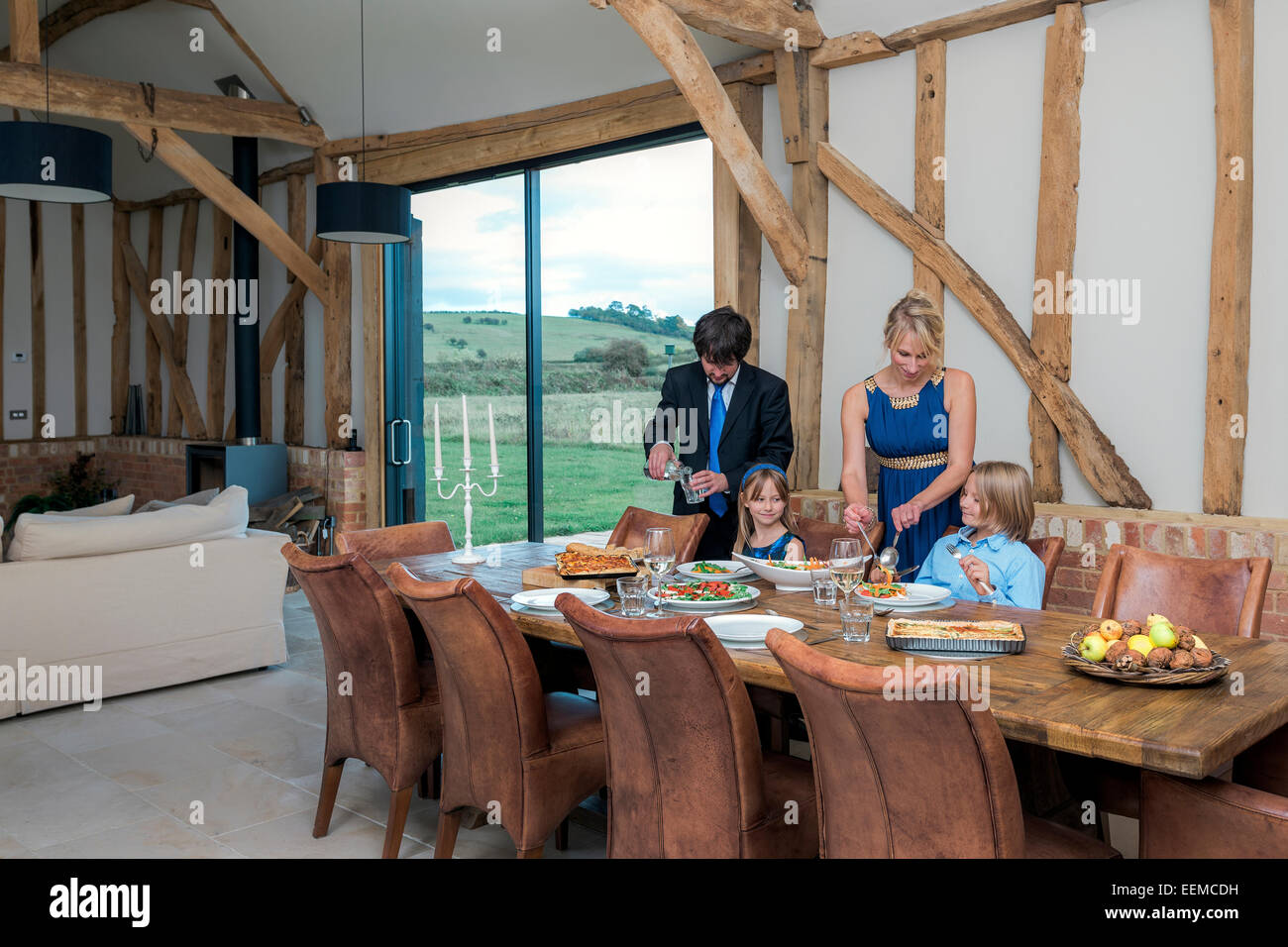 Caucasian family eating dinner in dining room Stock Photo - Alamy