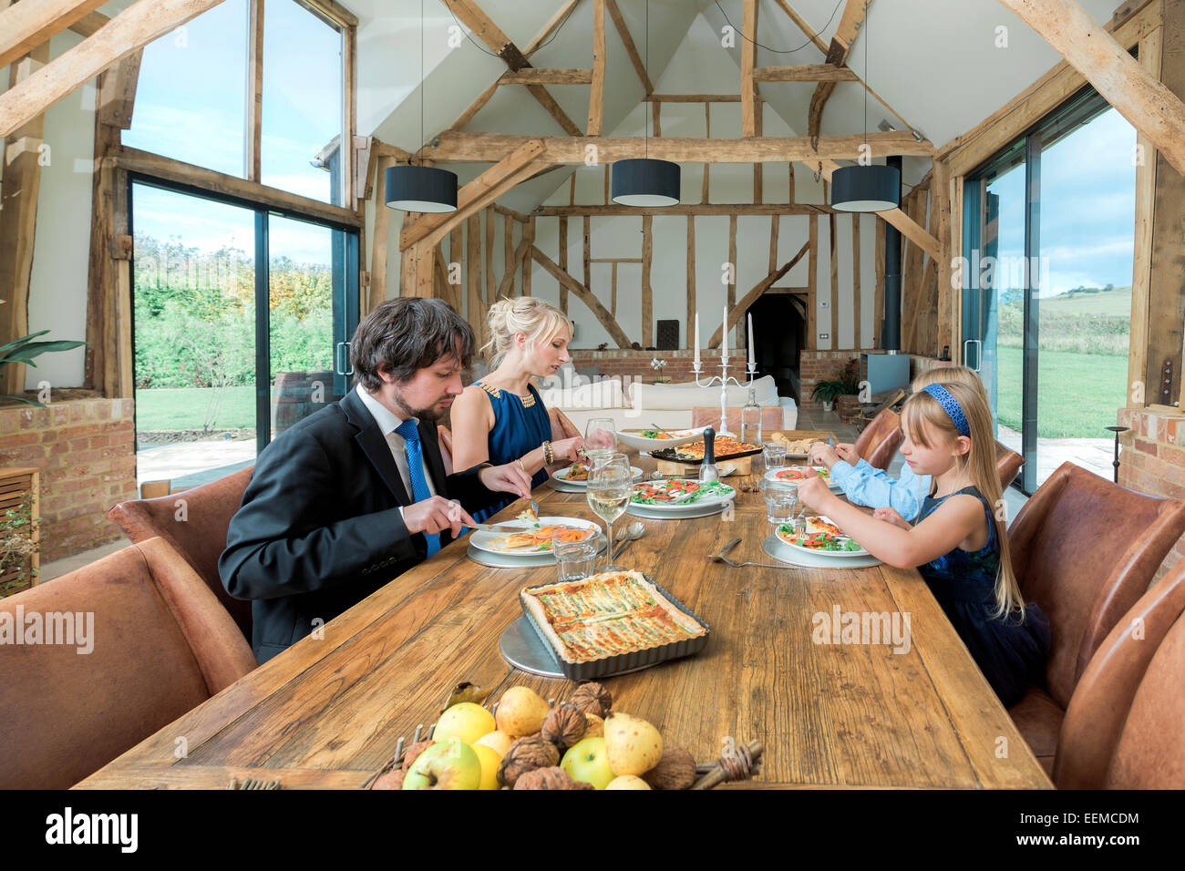 Caucasian family eating dinner in dining room Stock Photo - Alamy