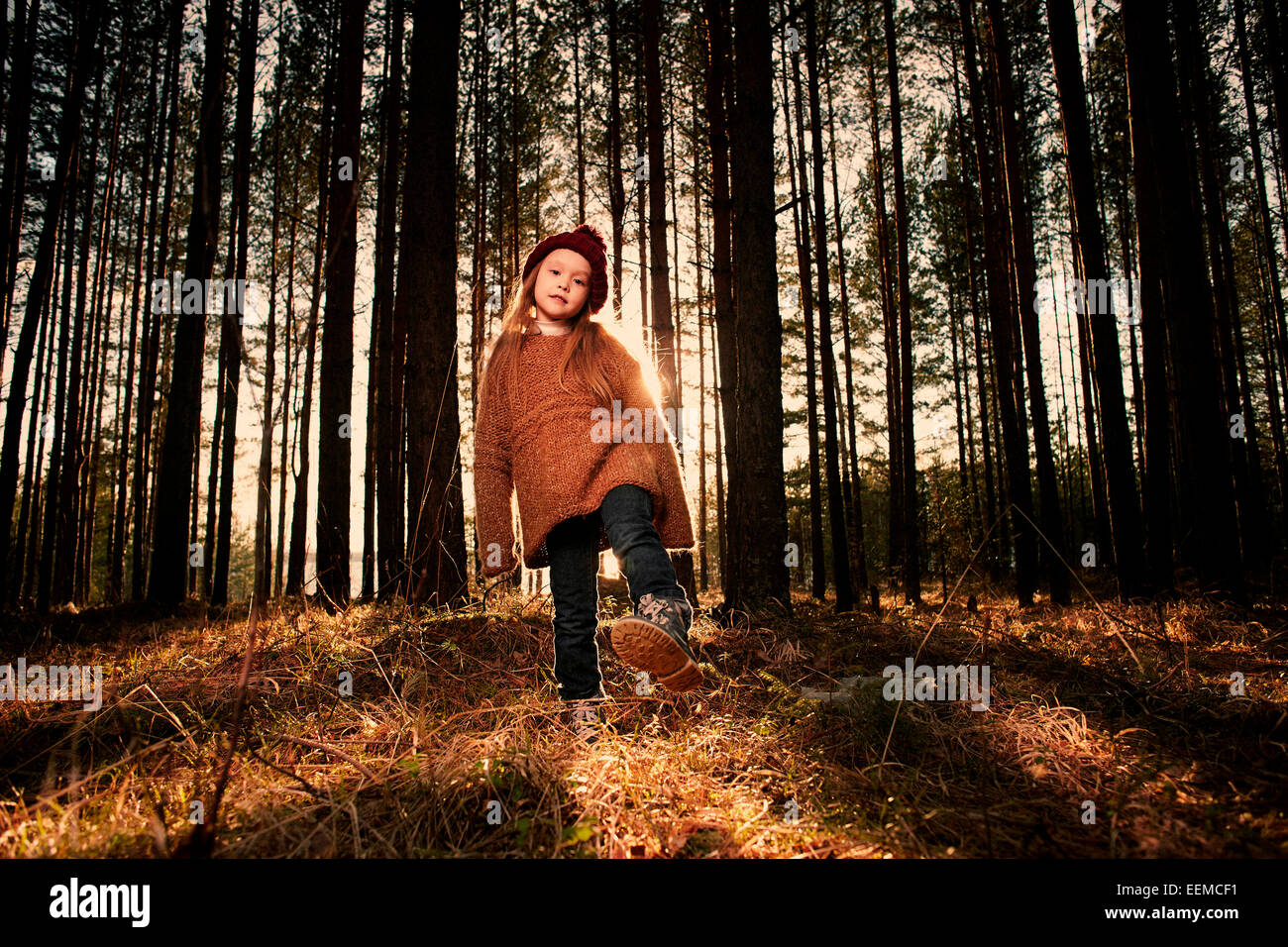 Caucasian girl playing in forest Stock Photo - Alamy