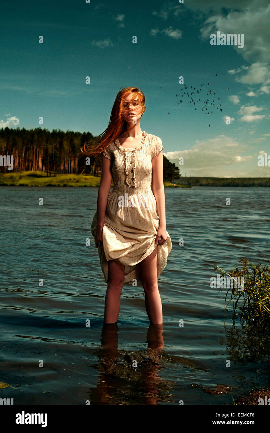 Woman wading lake dress hi-res stock photography and images - Alamy