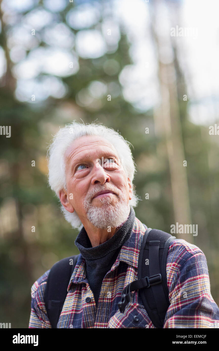 Caucasian hiker smiling in forest Stock Photo - Alamy